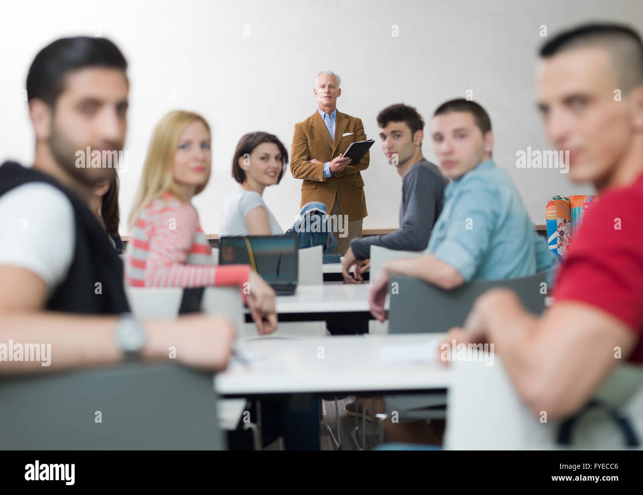 group of students study with senior professor in modern school ...