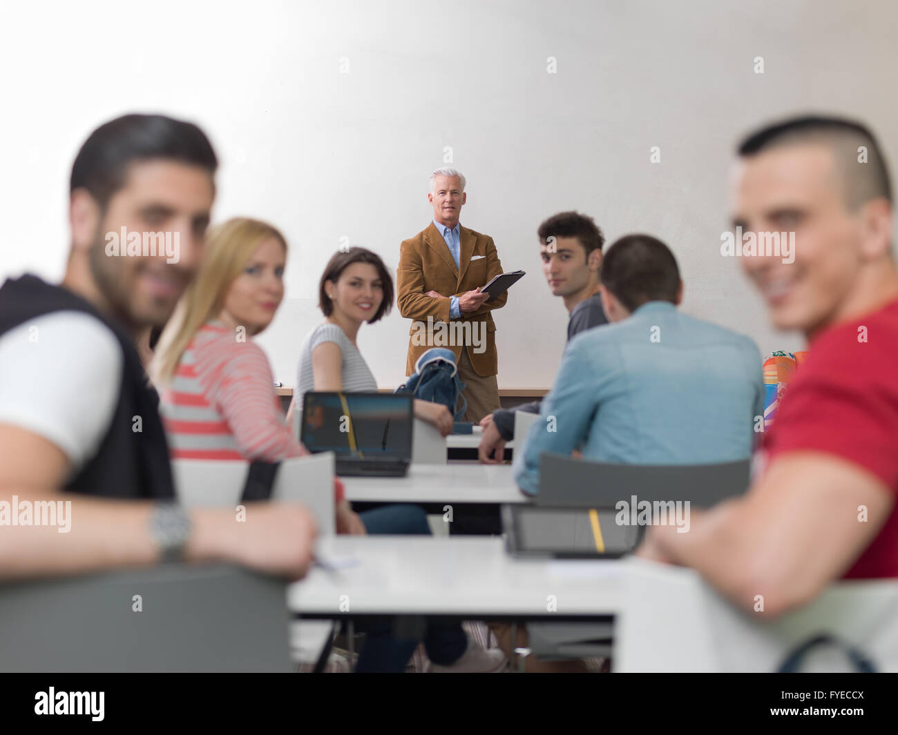 group of students study with senior professor in modern school ...
