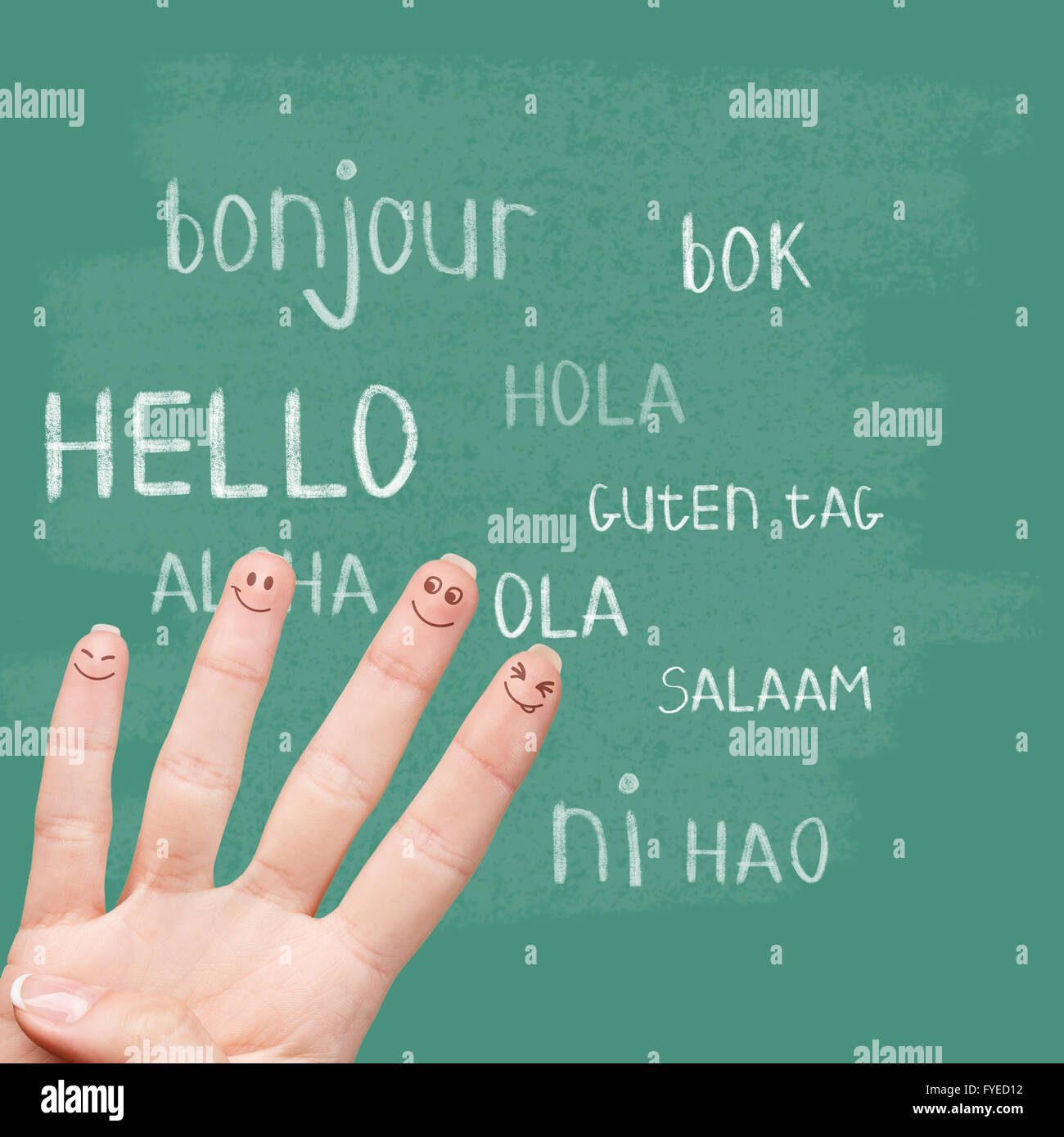 Hello in various languages on chalkboard Stock Photo - Alamy
