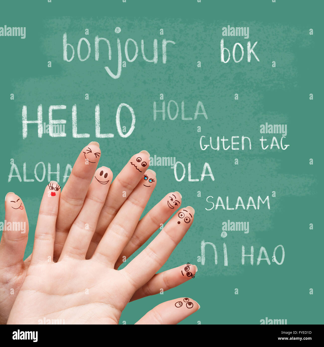 Hello in various languages on chalkboard Stock Photo - Alamy