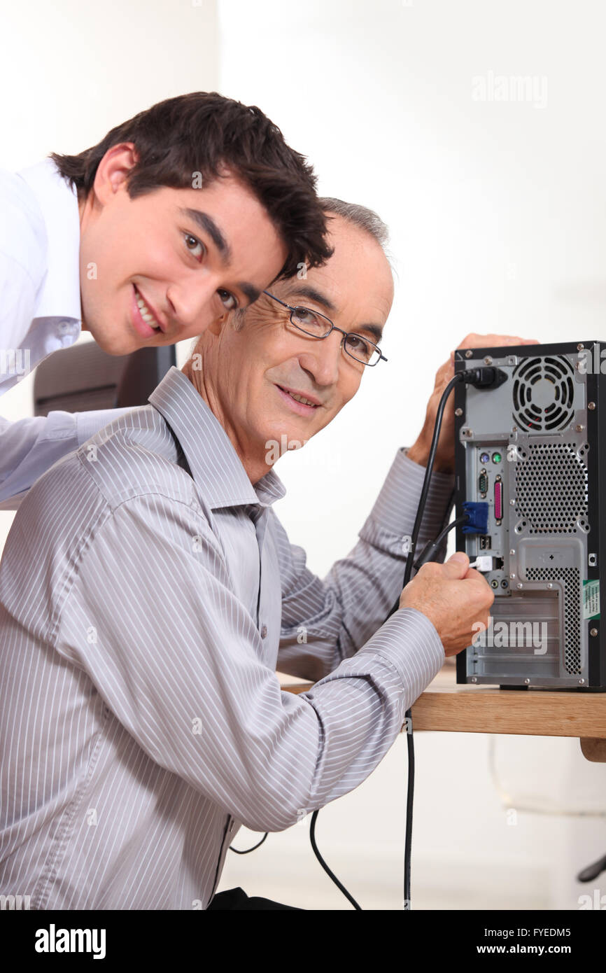 grandson and grandfather connecting a computer Stock Photo - Alamy