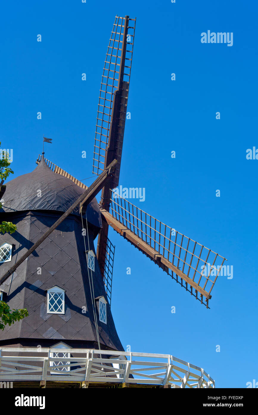 Black traditional swedish windmill with blue sky in summer outdoors in ...