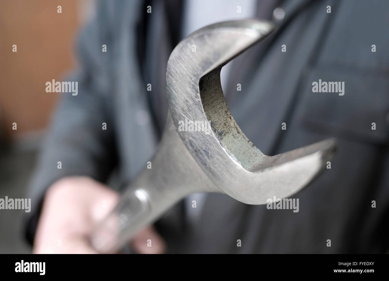 male motor mechanic holding large open ended spanner Stock Photo - Alamy