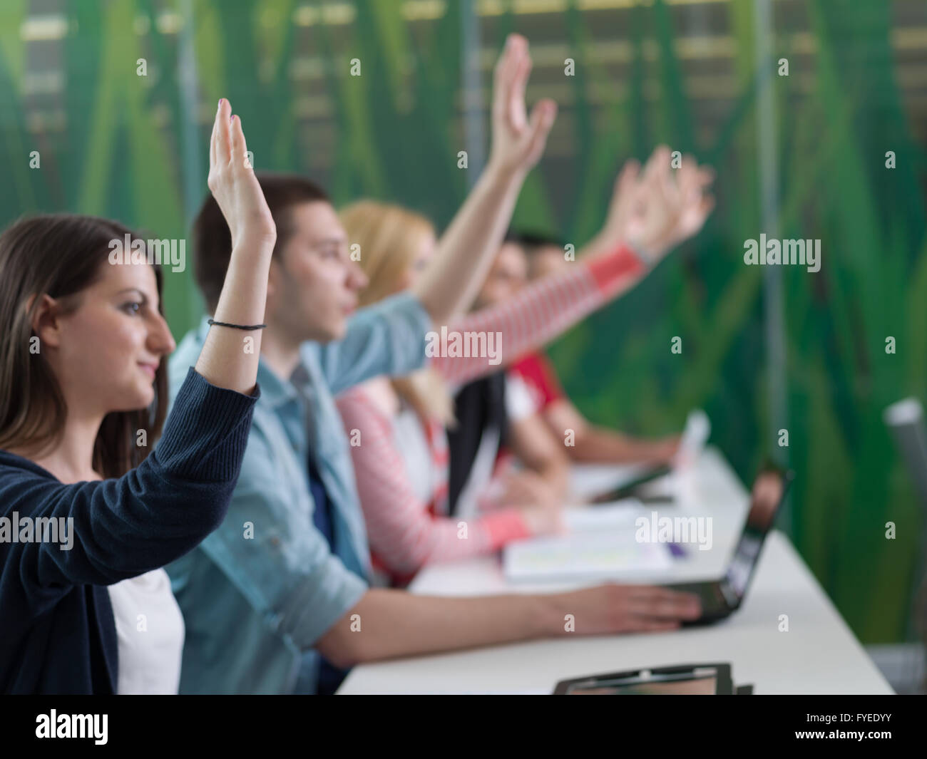 senior teacher teaching lessons, smart students group raise hands up in ...