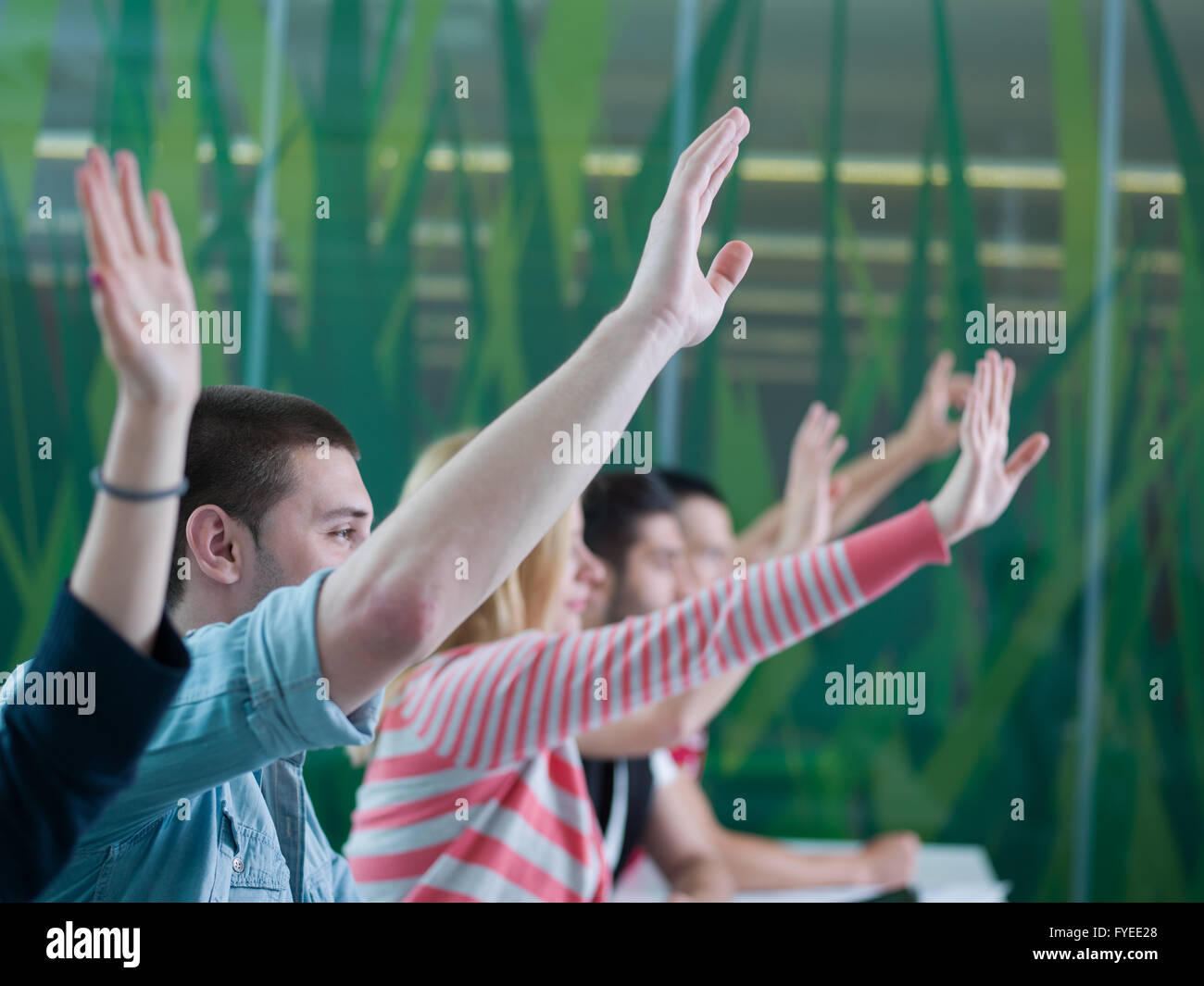 senior teacher teaching lessons, smart students group raise hands up in ...
