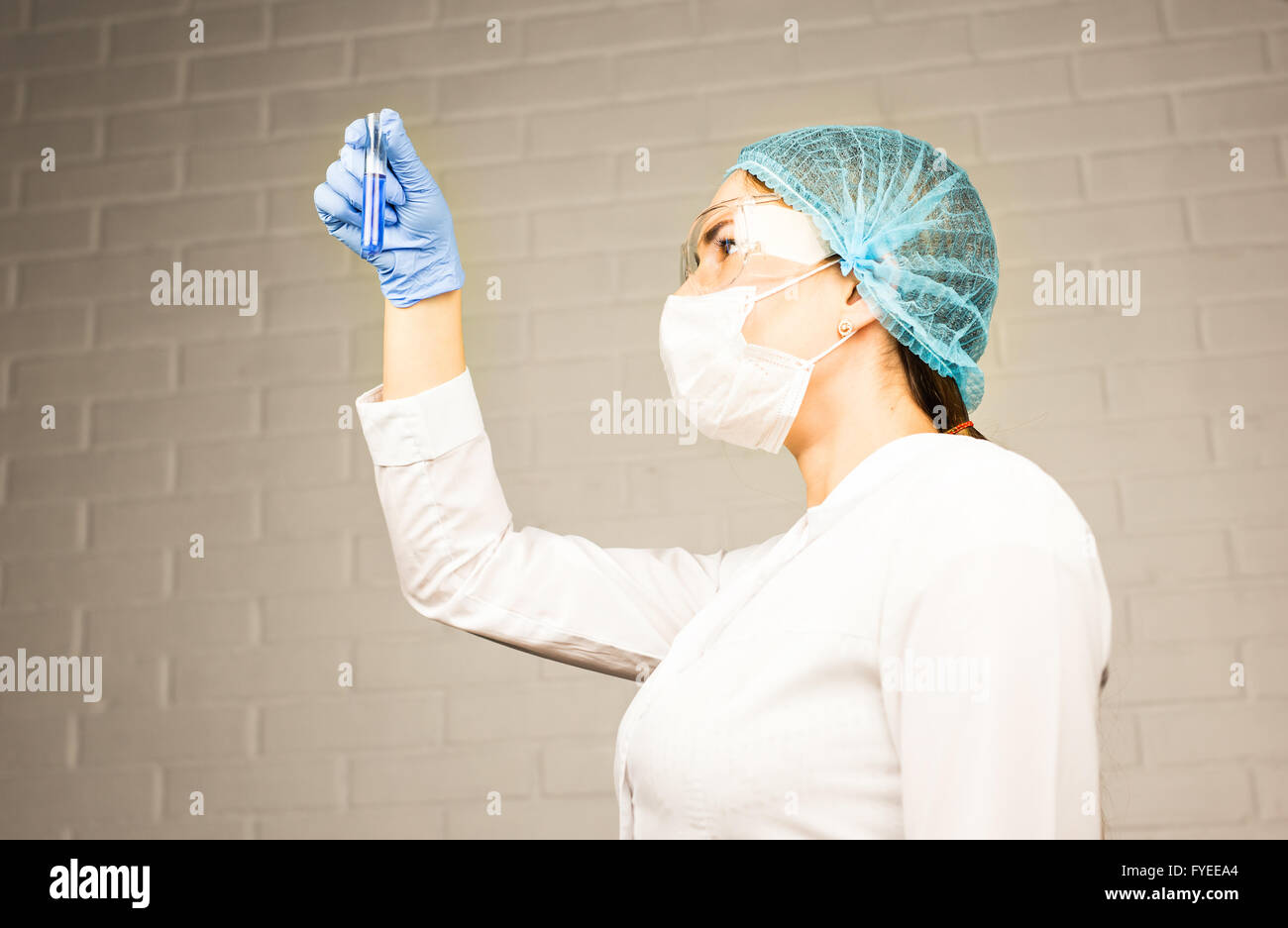 Scientist looking at test tube in the laboratory Stock Photo - Alamy