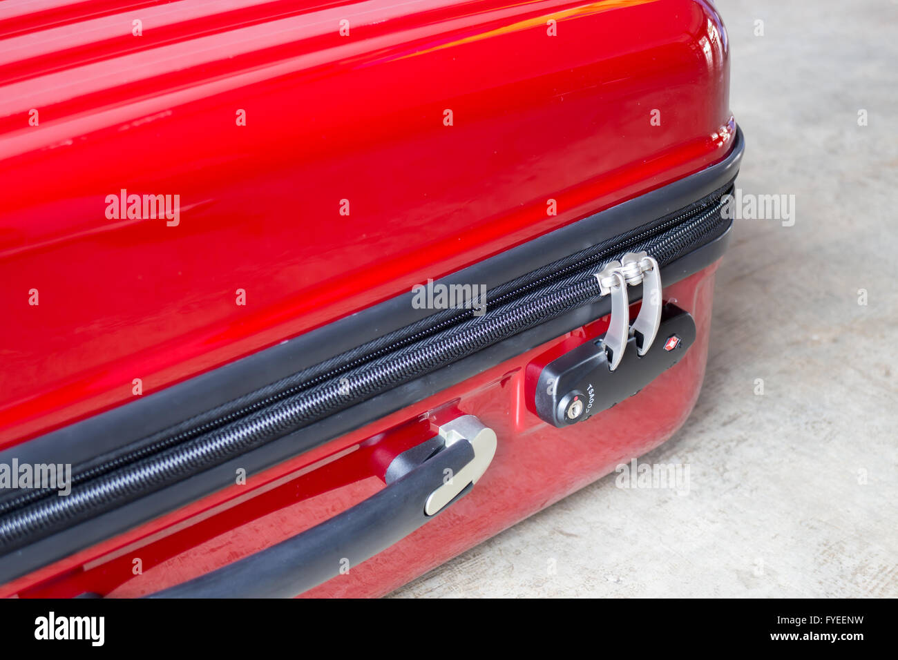 Locked and zip closed of red suitcase, stock photo Stock Photo - Alamy