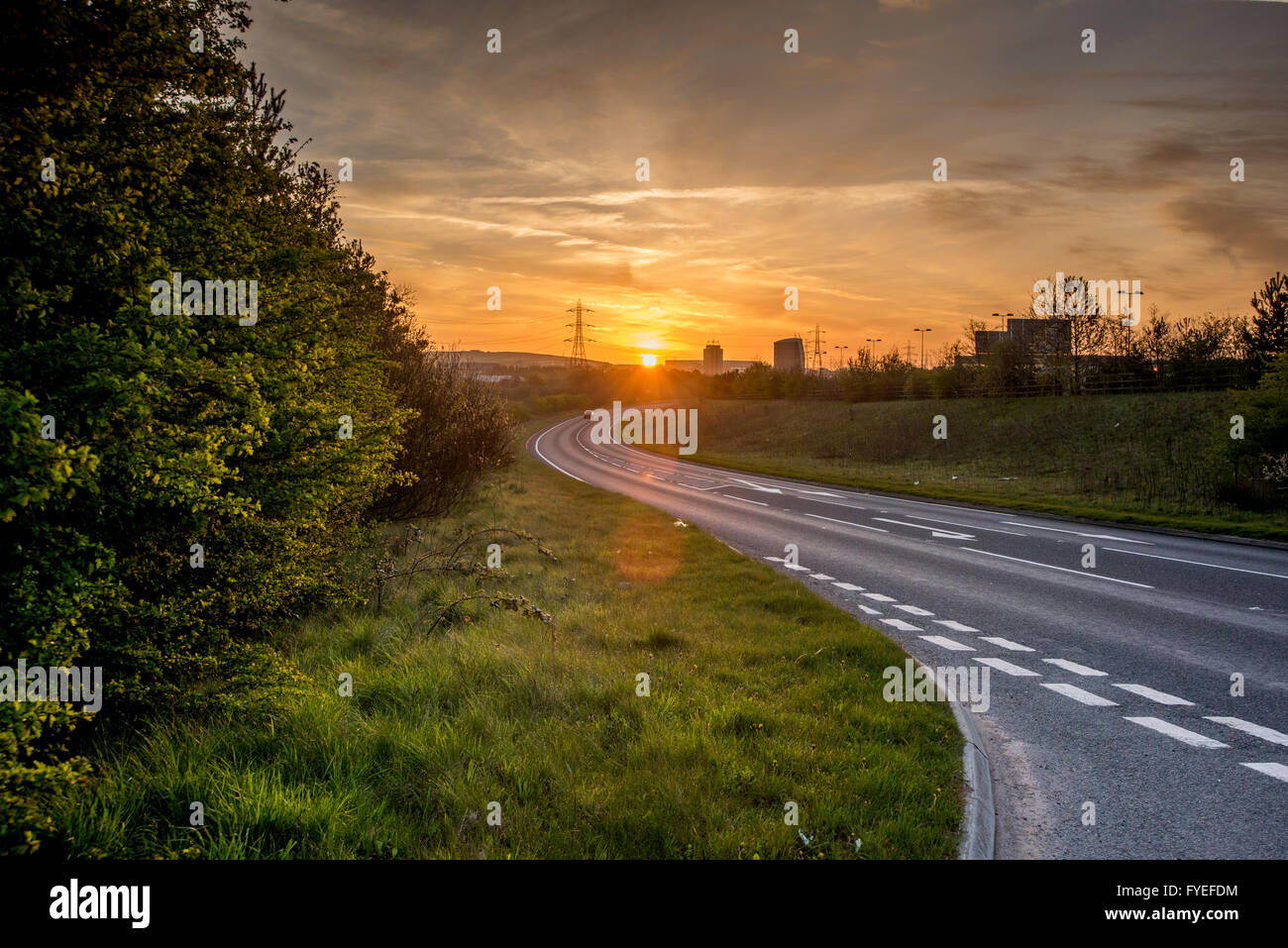 Sunrise over a winding road in Cannock Stock Photo - Alamy