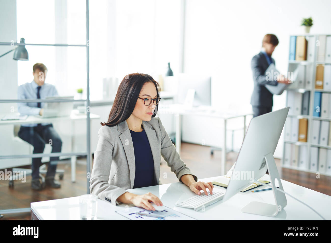 Secretary by computer Stock Photo - Alamy
