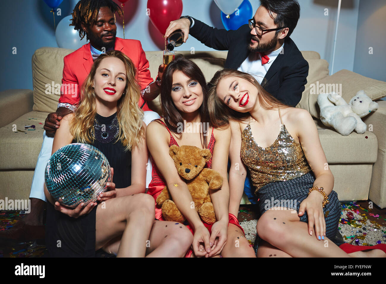 Relaxing at party Stock Photo - Alamy