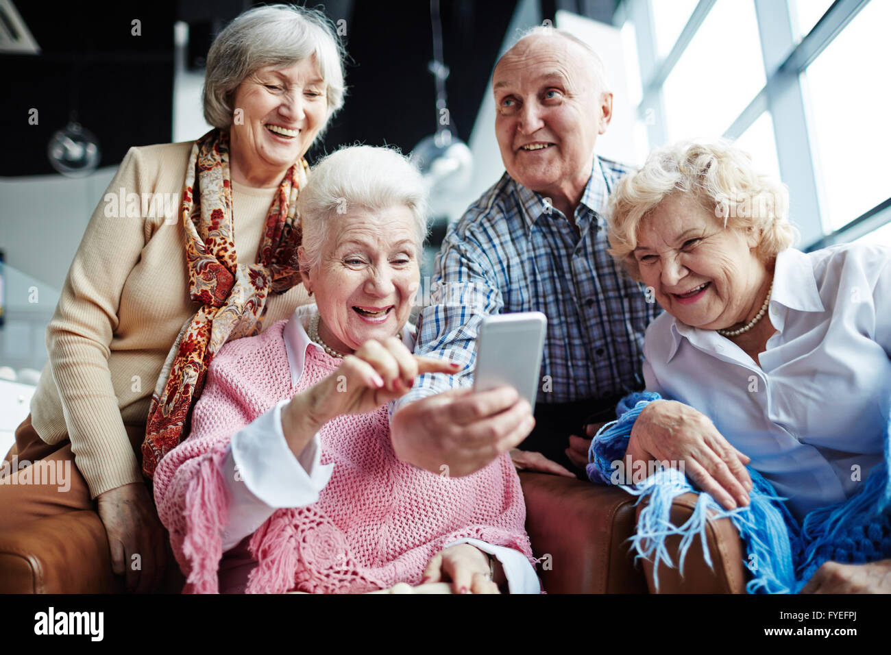 Seniors with smartphone Stock Photo - Alamy