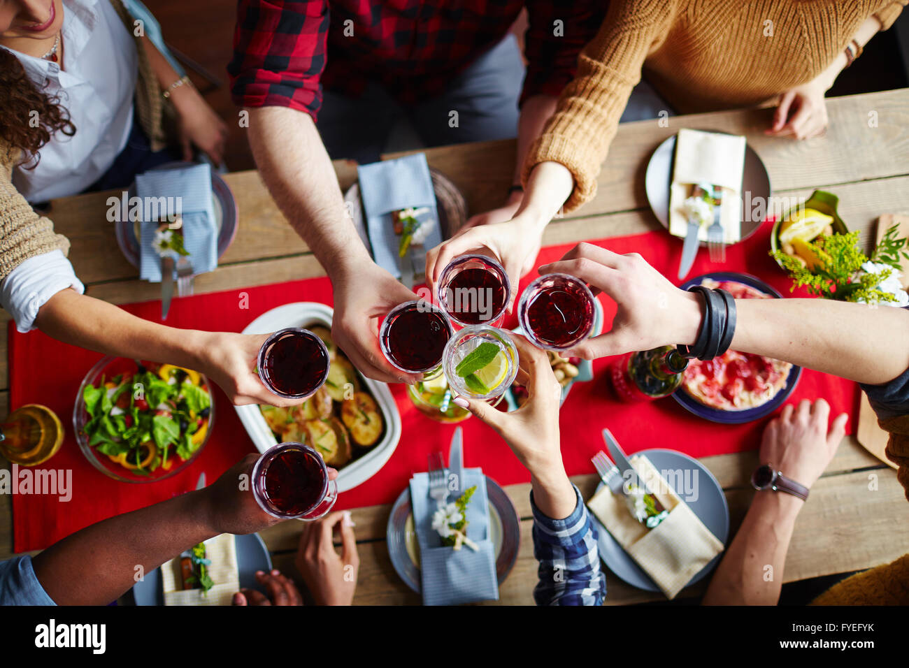 Toasting during dinner Stock Photo - Alamy
