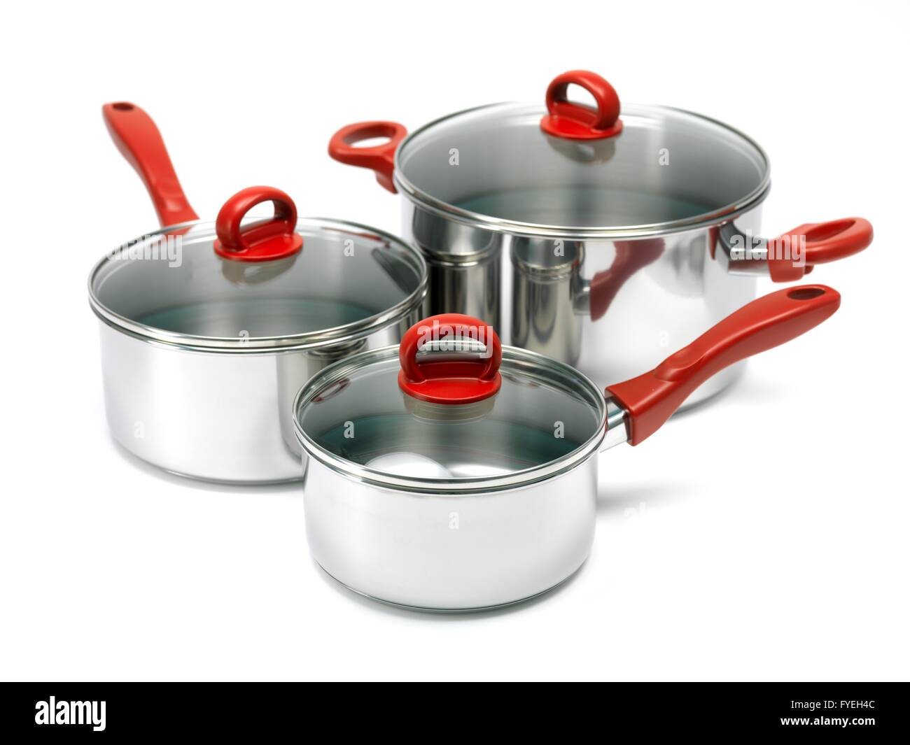 Silver cooking pots isolated against a white background Stock Photo - Alamy