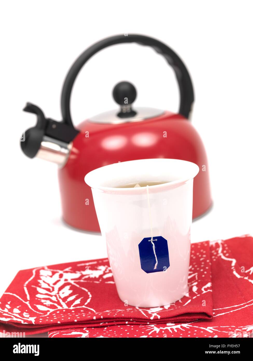 A stove top kettle and a cup of tea on a kitchen bench Stock Photo - Alamy