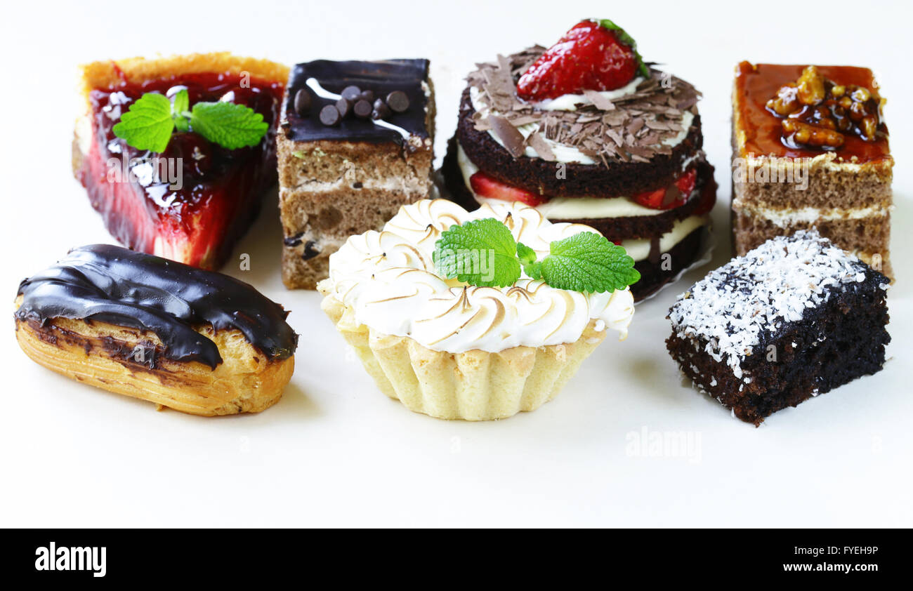 Assorted desserts, cakes and pastries on a white background Stock Photo ...