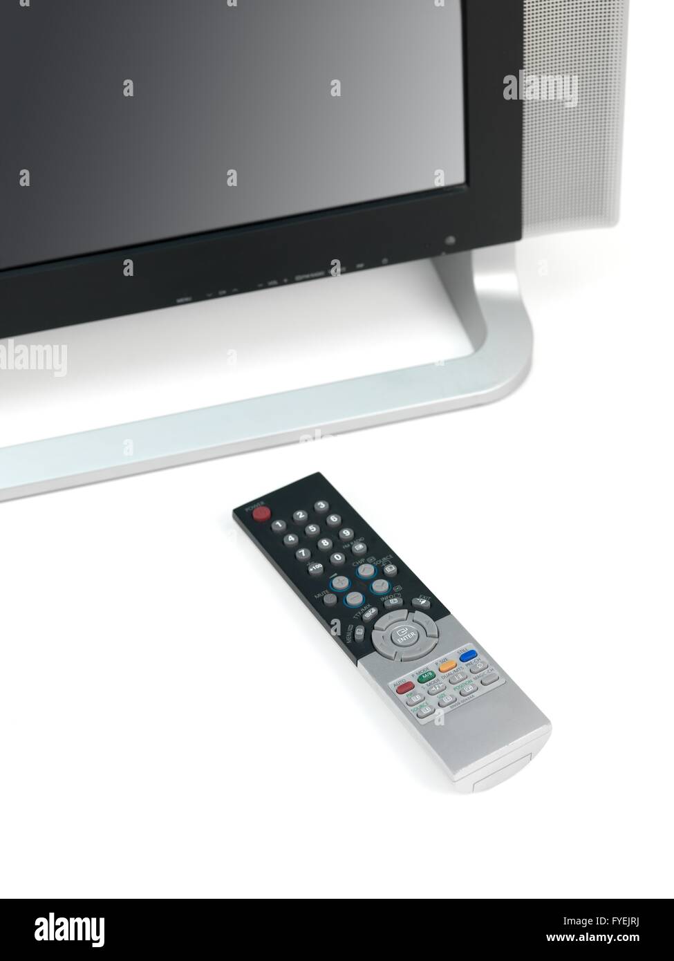 A LCD TV monitor and remote control isolated against a white background ...