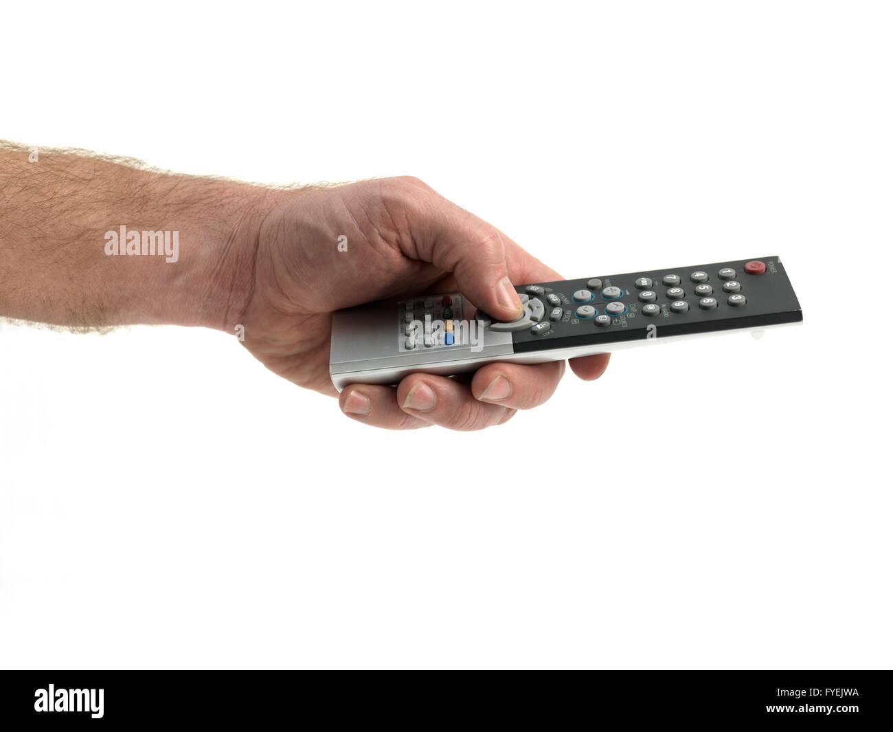 A remote control held in the hand isolated against a white background ...