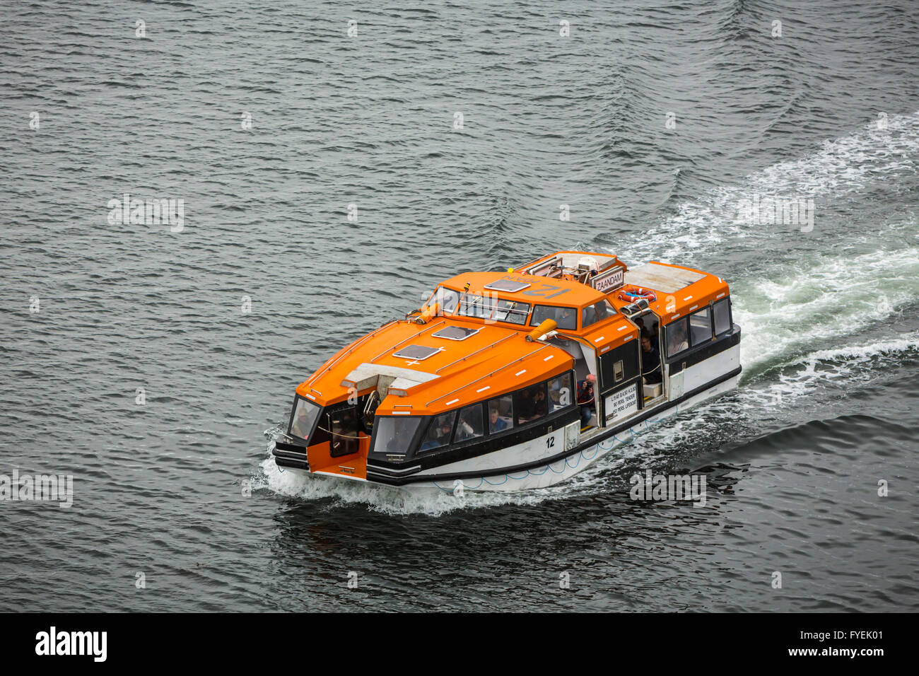 A tender boat from the cruise ship Zaandam off the village of Castro ...