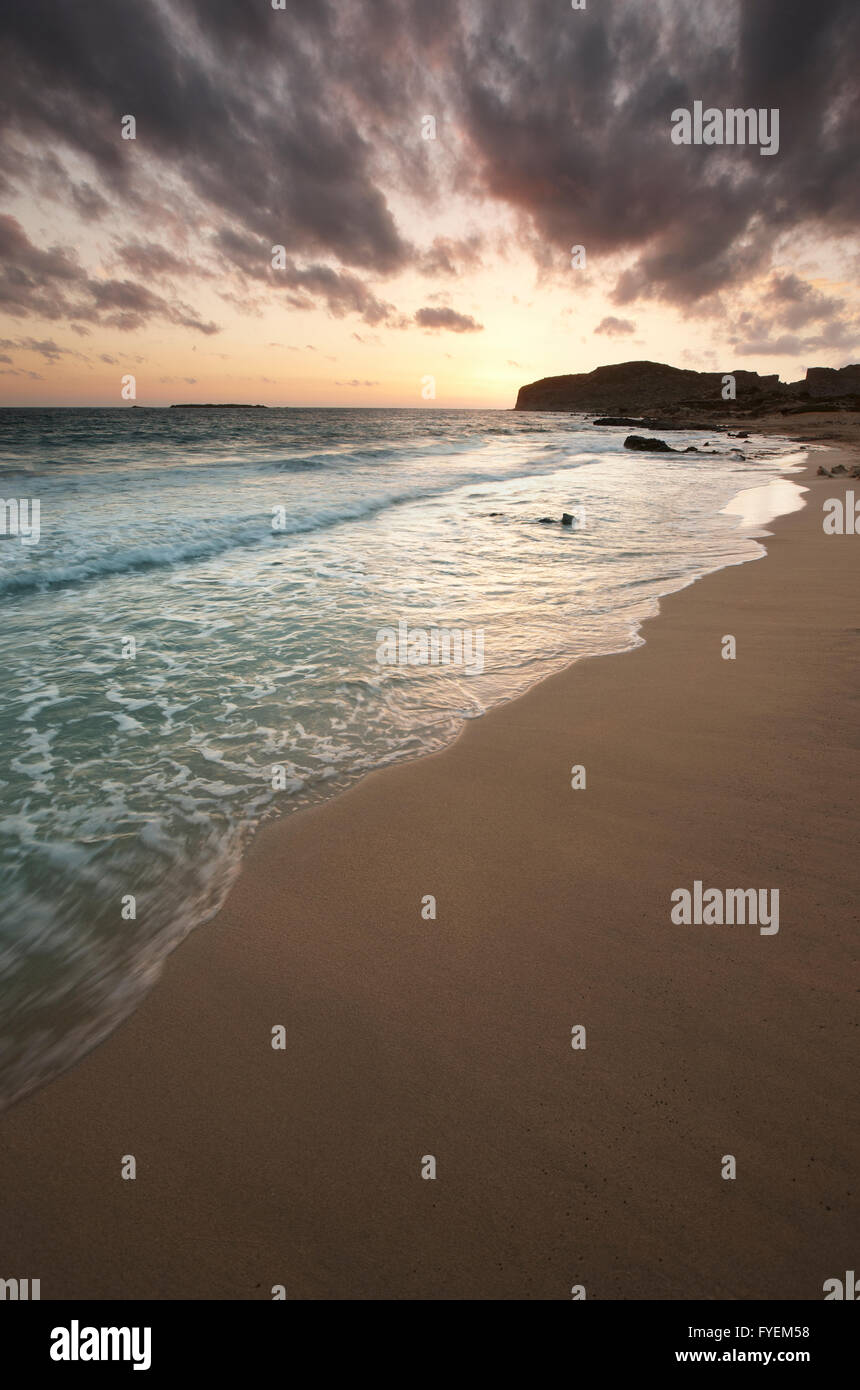 Sunset at the beach. Crete. Greece. Vertical format Stock Photo - Alamy