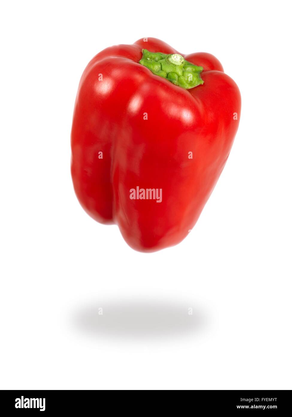 A red capsicum isolated against a white background Stock Photo - Alamy