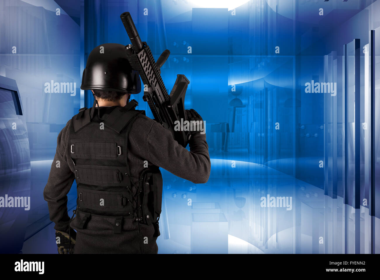 Armed man in protective cask with a machine gun on the modern building ...