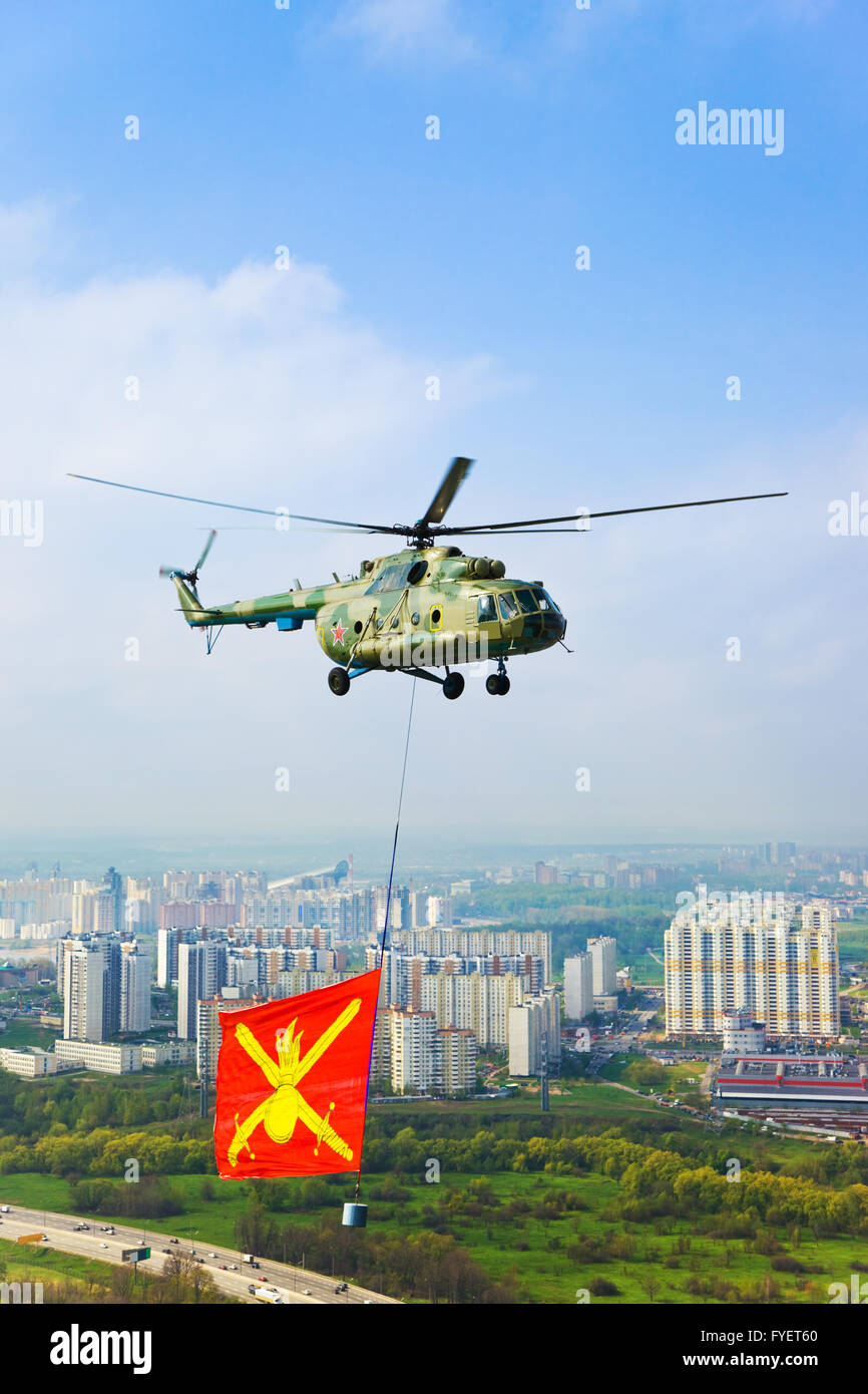 Helicopter with military flag over Moscow at parade of victory day ...