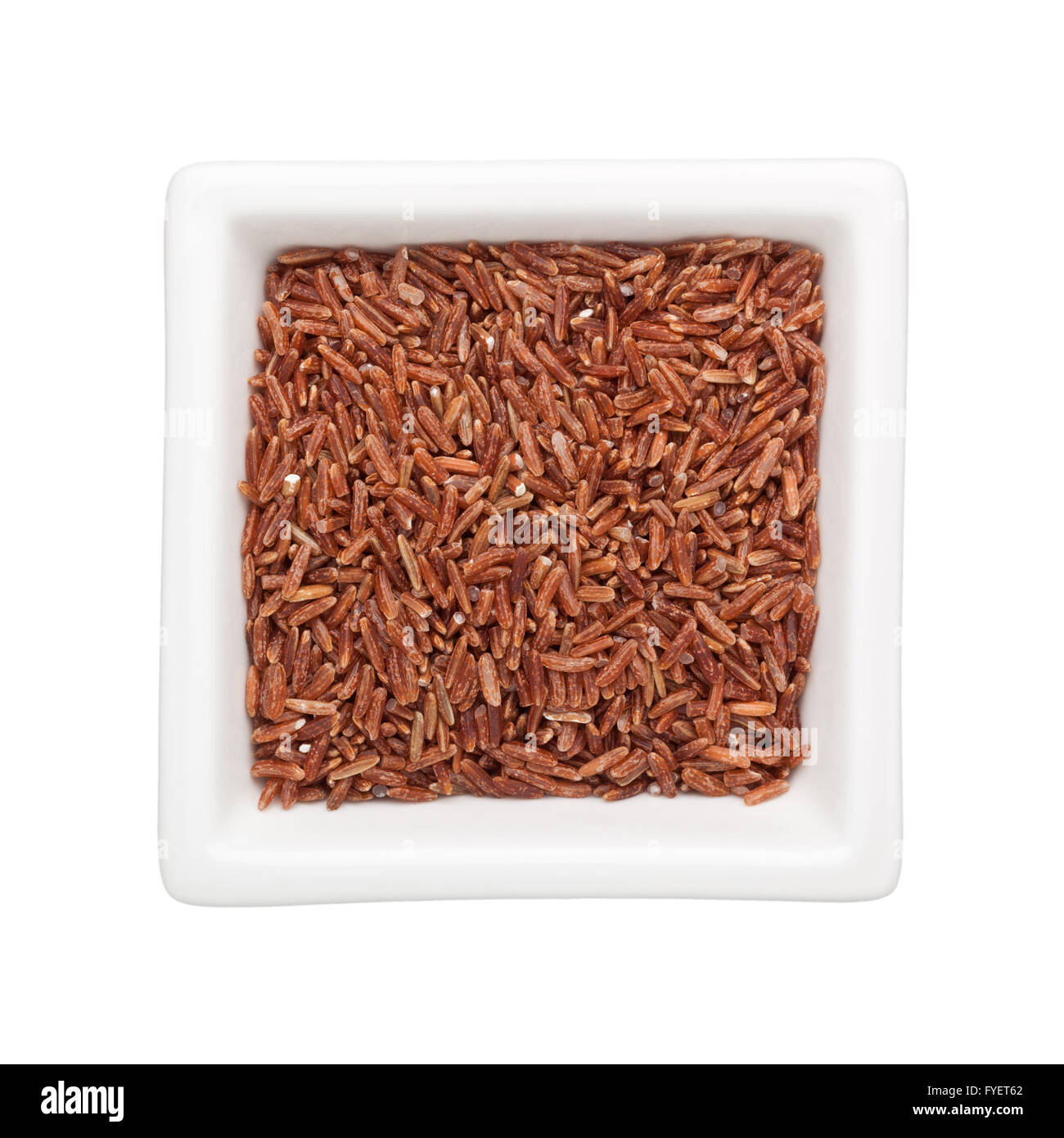 Red cargo rice in a square bowl isolated on white background Stock ...