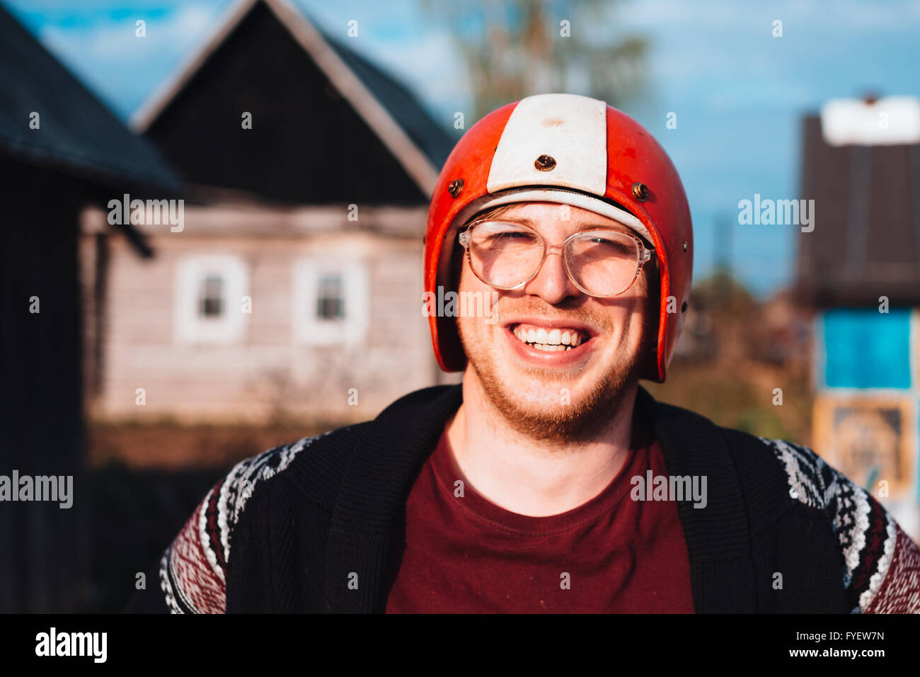 Smiling man in a helmet and glasses Stock Photo - Alamy