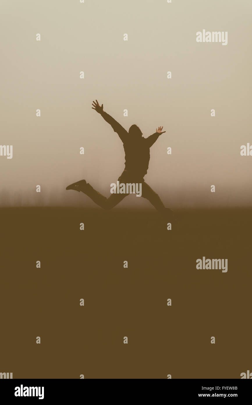 Silhouette of the jumping person Stock Photo - Alamy