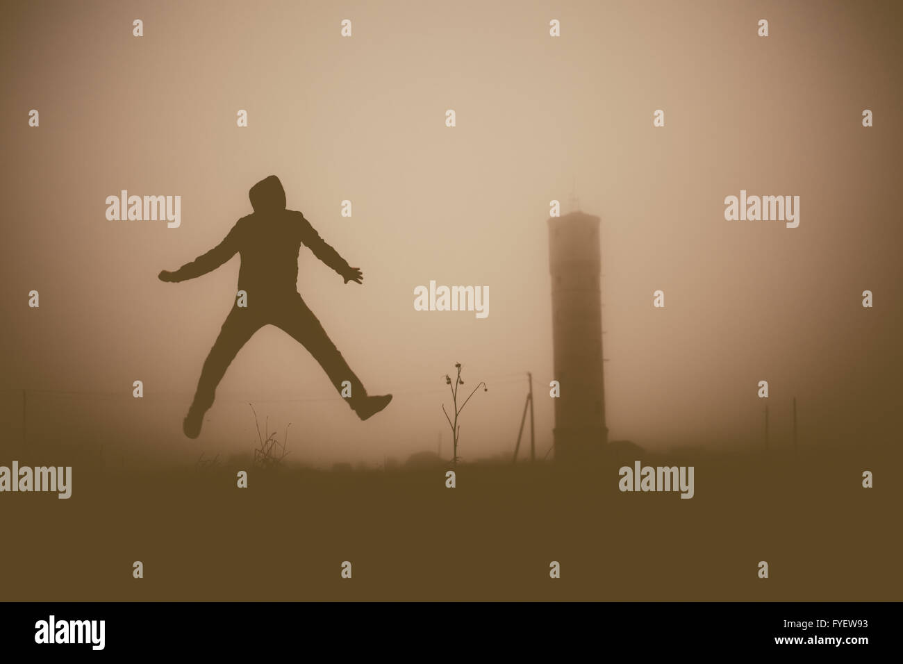 Silhouette of the jumping person in the evening Stock Photo - Alamy
