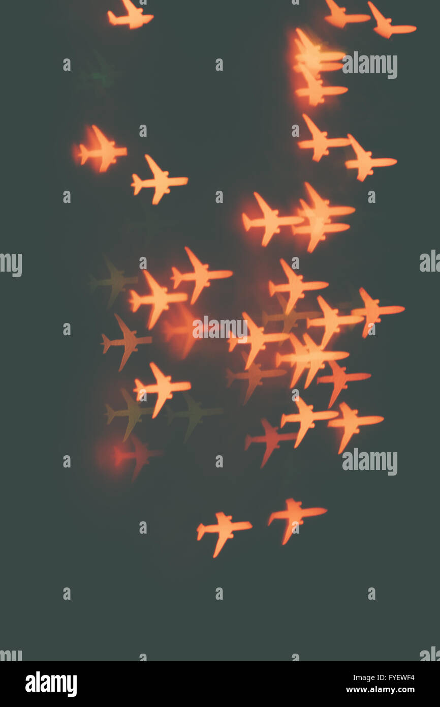 Many orange airplanes on a dark background Stock Photo - Alamy
