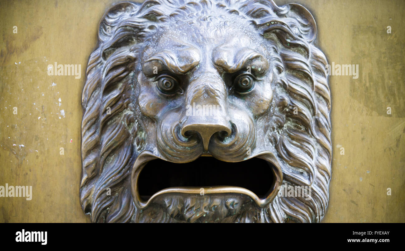 Bas-relief of a head of a lion on a wall Stock Photo - Alamy