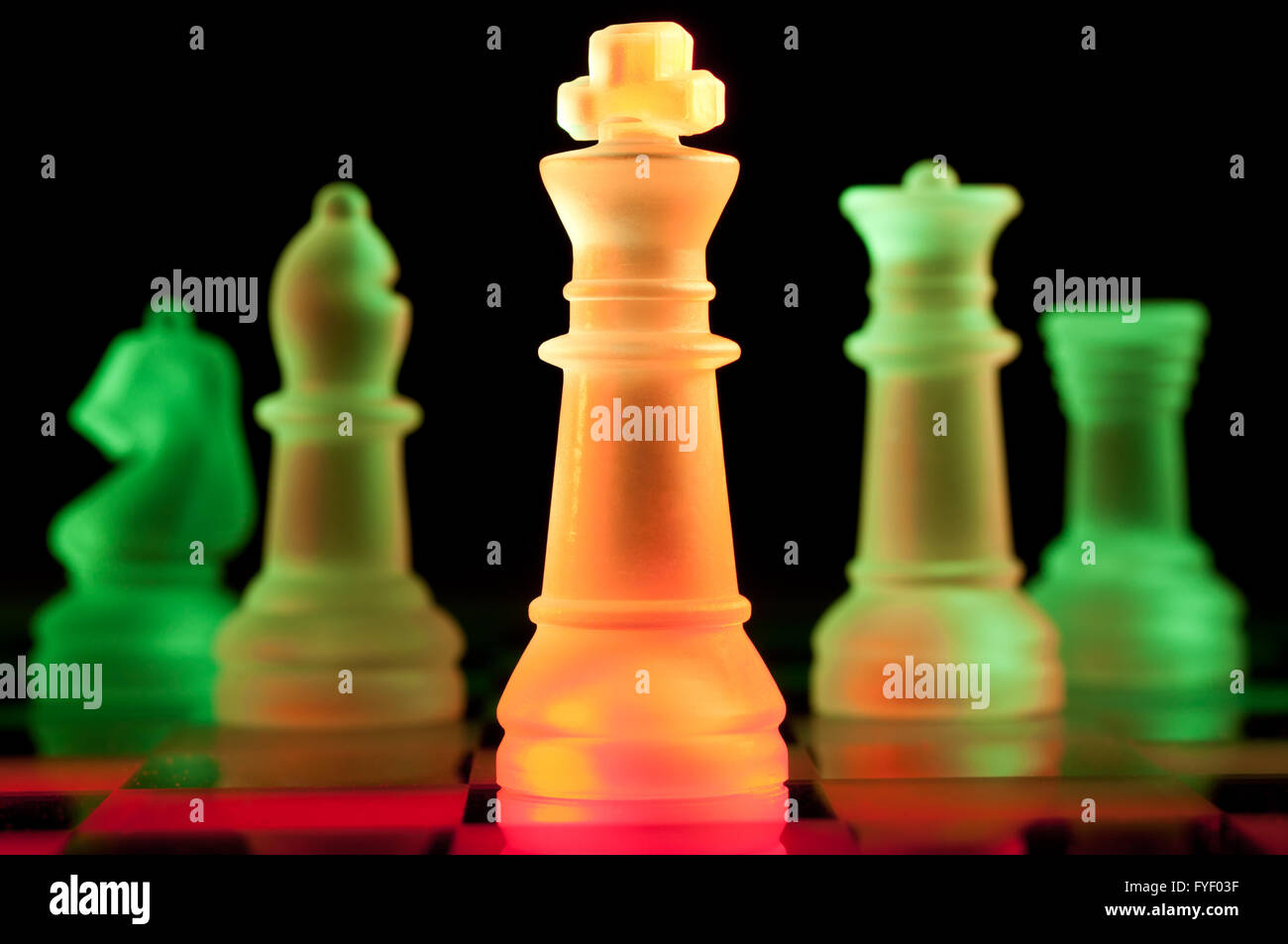 red and green glass chess pieces Stock Photo - Alamy