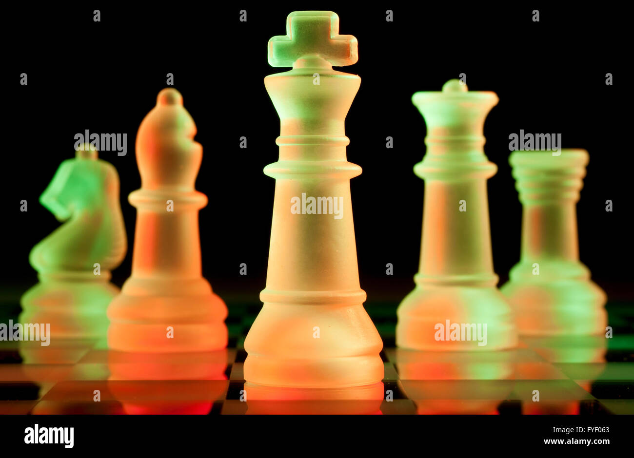 red and green glass chess pieces Stock Photo - Alamy