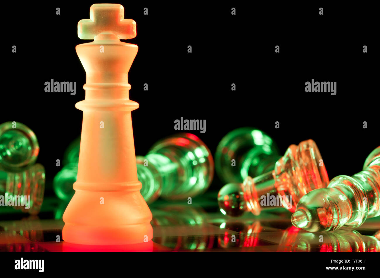 red and green glass chess pieces Stock Photo - Alamy