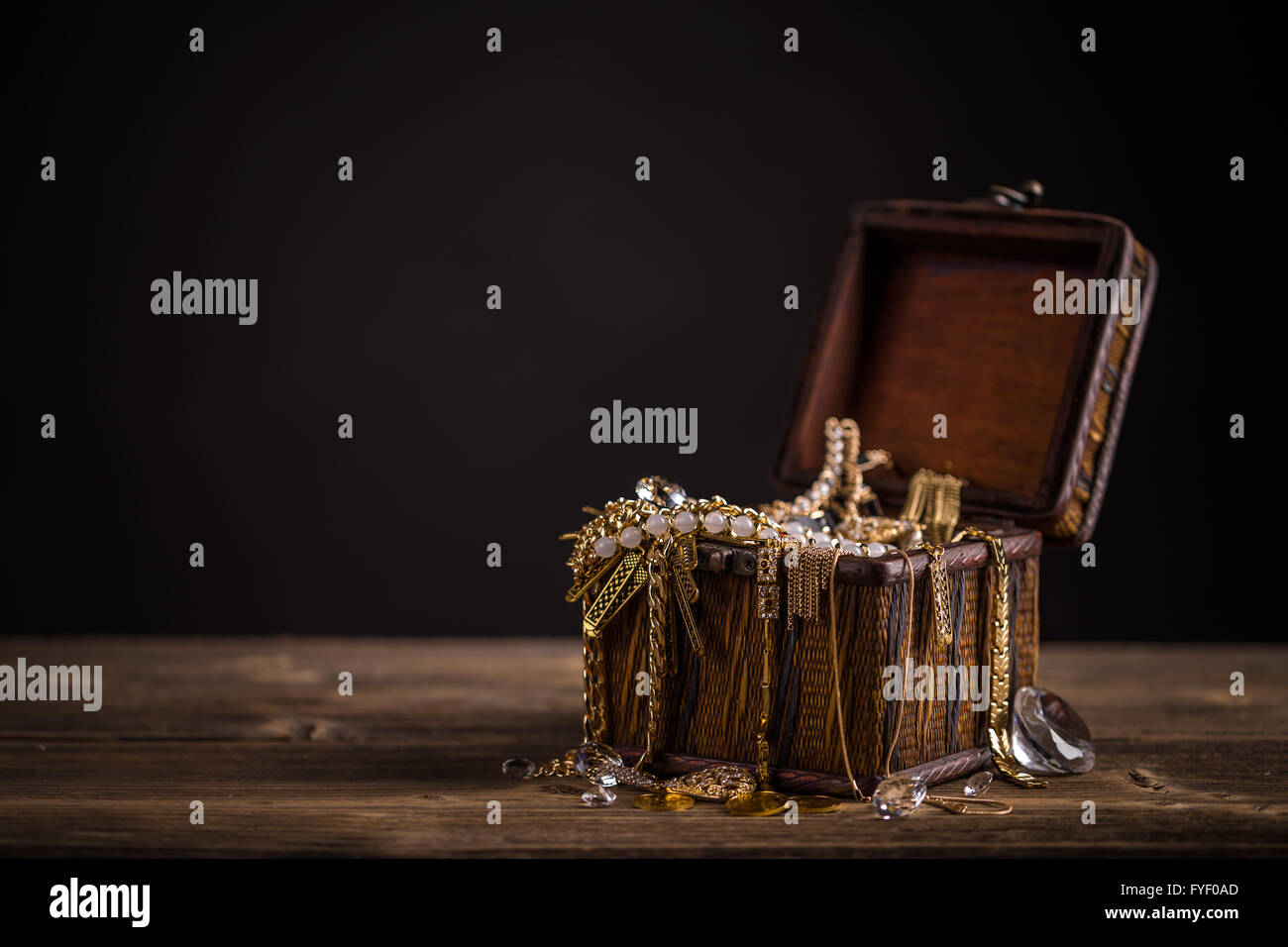 Small pirate treasure chest on wooden table Stock Photo - Alamy