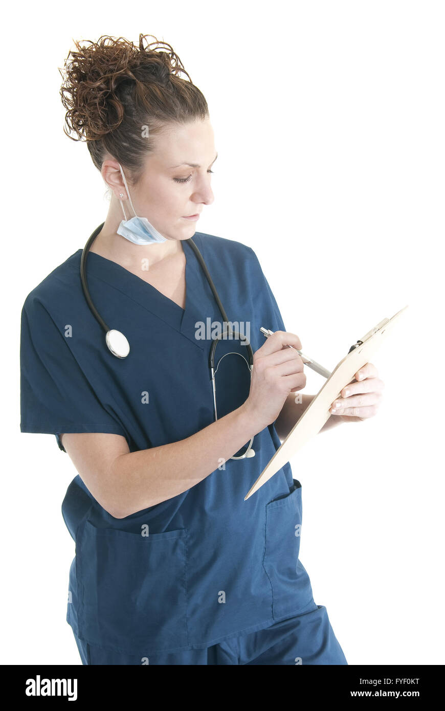 Nurse writing on a clipboard Stock Photo - Alamy