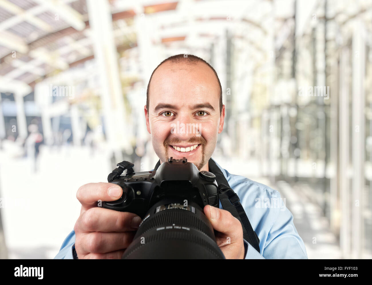portrait of photographer and modern building background Stock Photo - Alamy