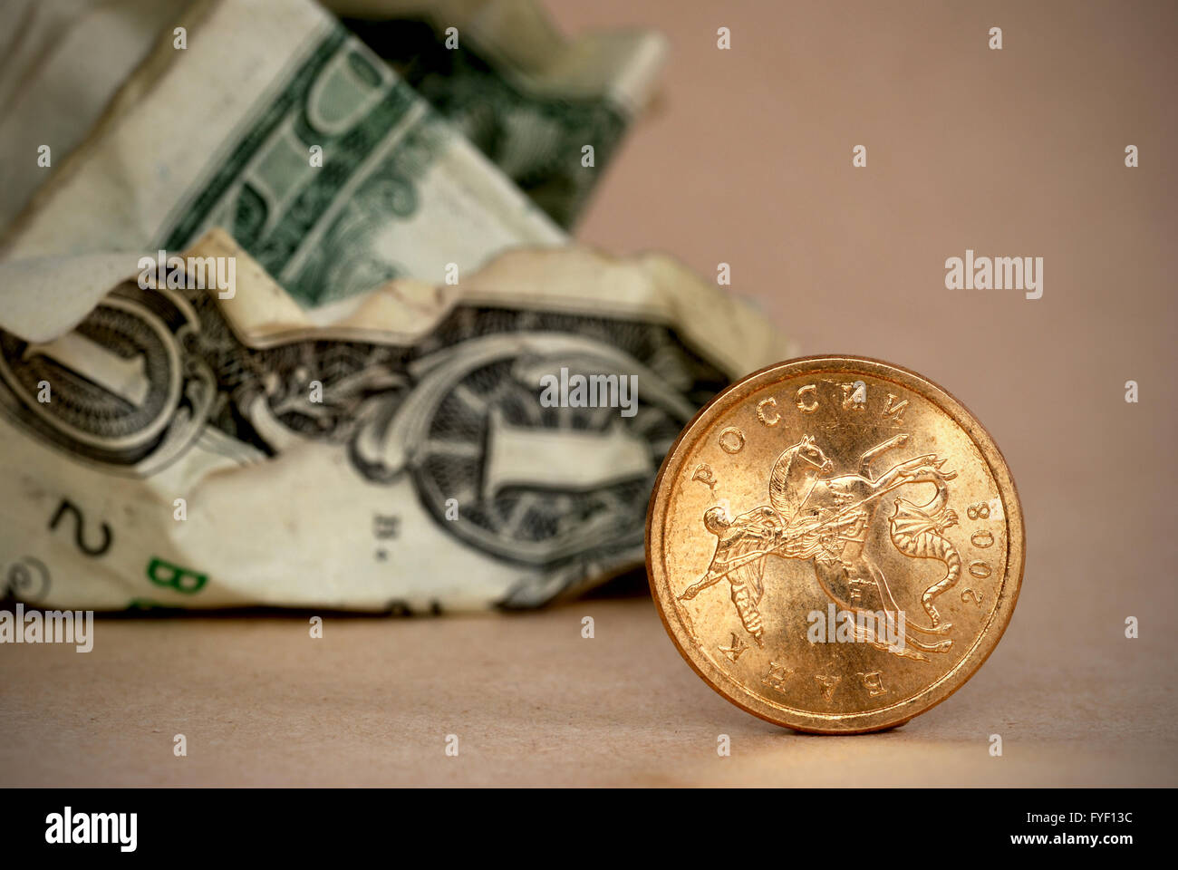 USD banknote and golden coin Stock Photo - Alamy