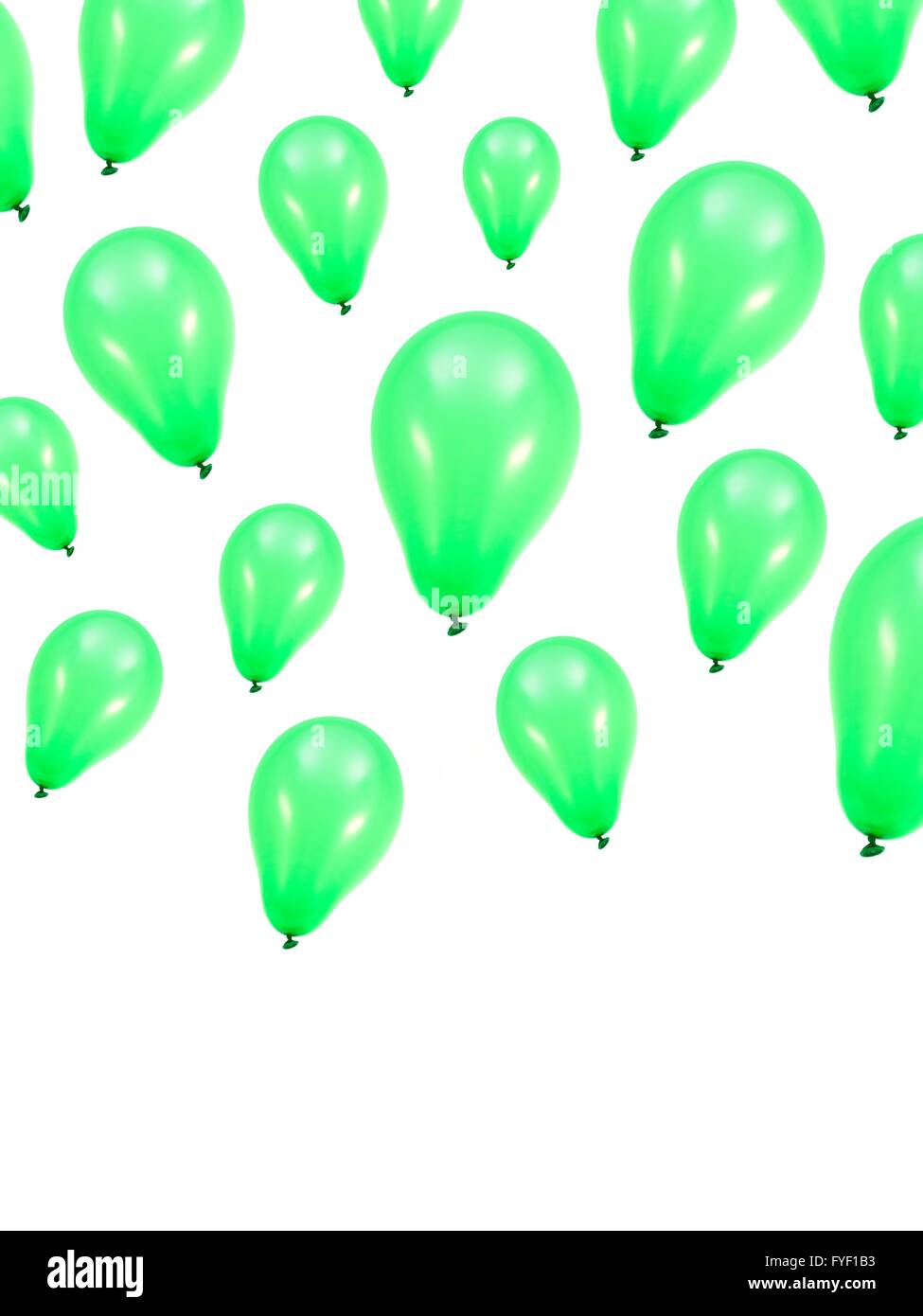 Green balloons isolated against a white background Stock Photo - Alamy