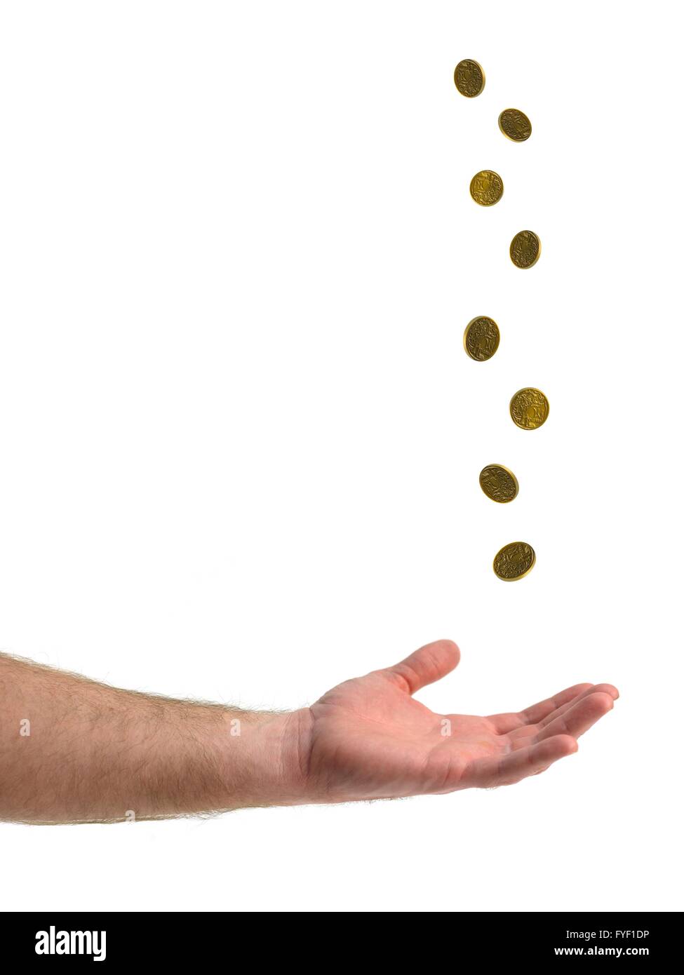 A hand catching falling coin isolated against a white background Stock ...