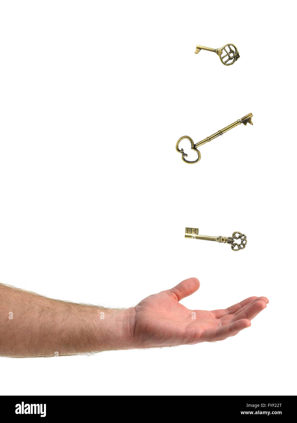 A hand catching falling keys isolated against a white background Stock ...