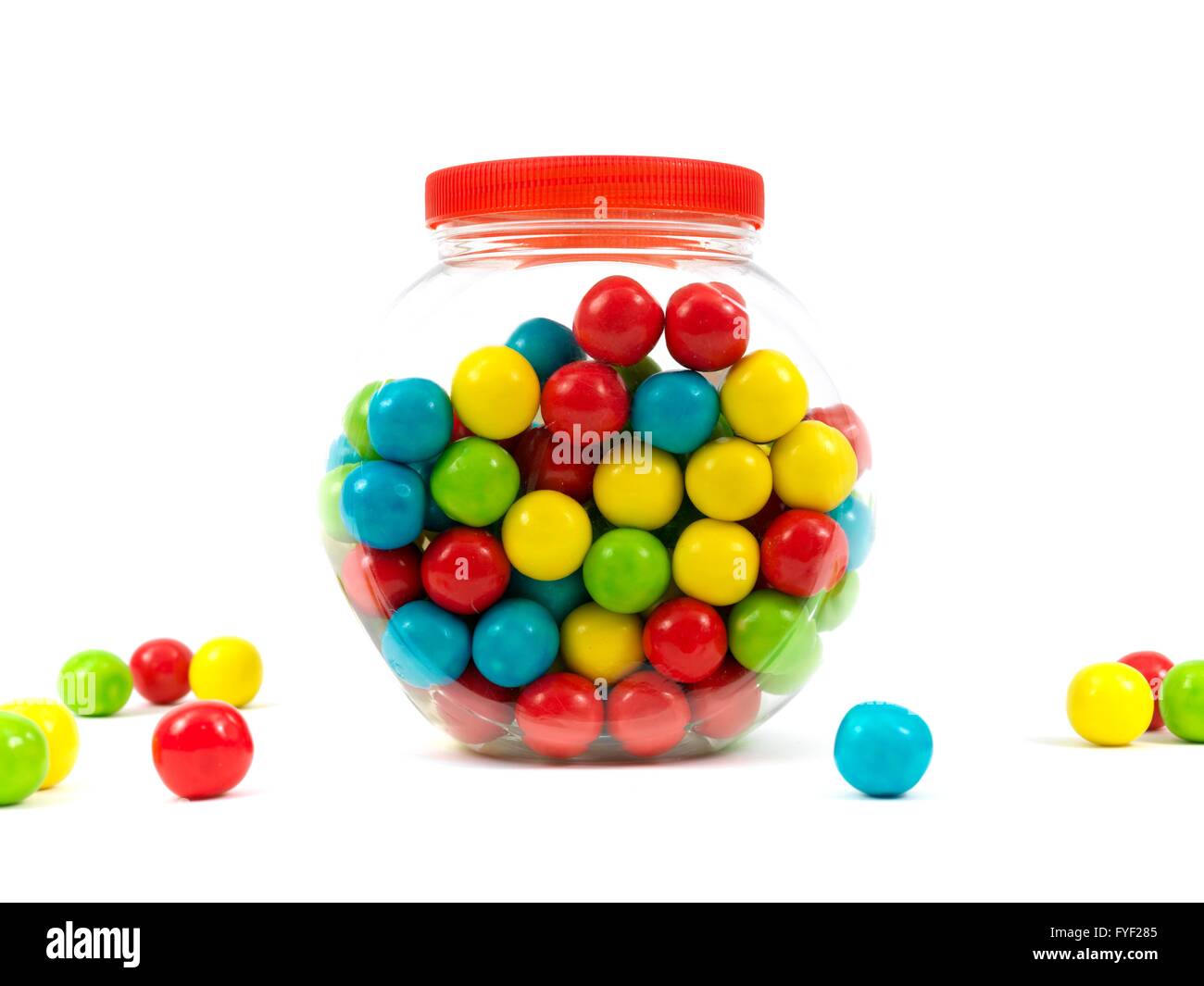 Gumballs in a jar isolated against a white background Stock Photo - Alamy