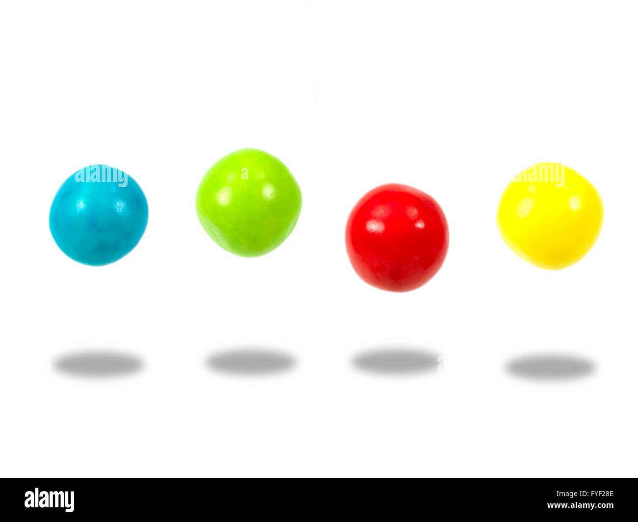 Large colored gumballs set against a white background Stock Photo - Alamy