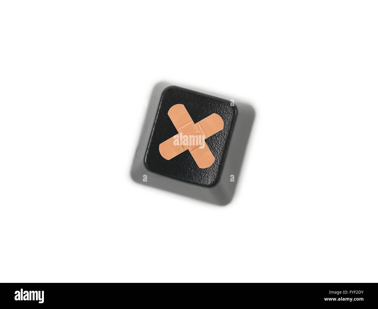 A keyboard key and a band aid isolated against a white background Stock ...