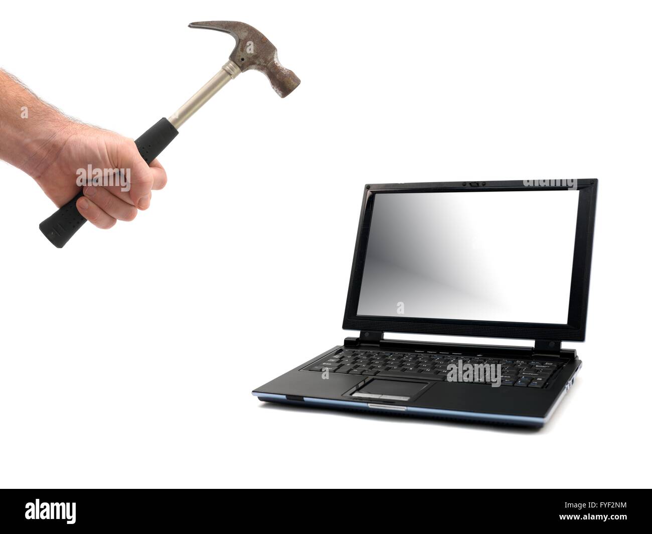 A metal hammer smashing a laptop isolated against a white background ...