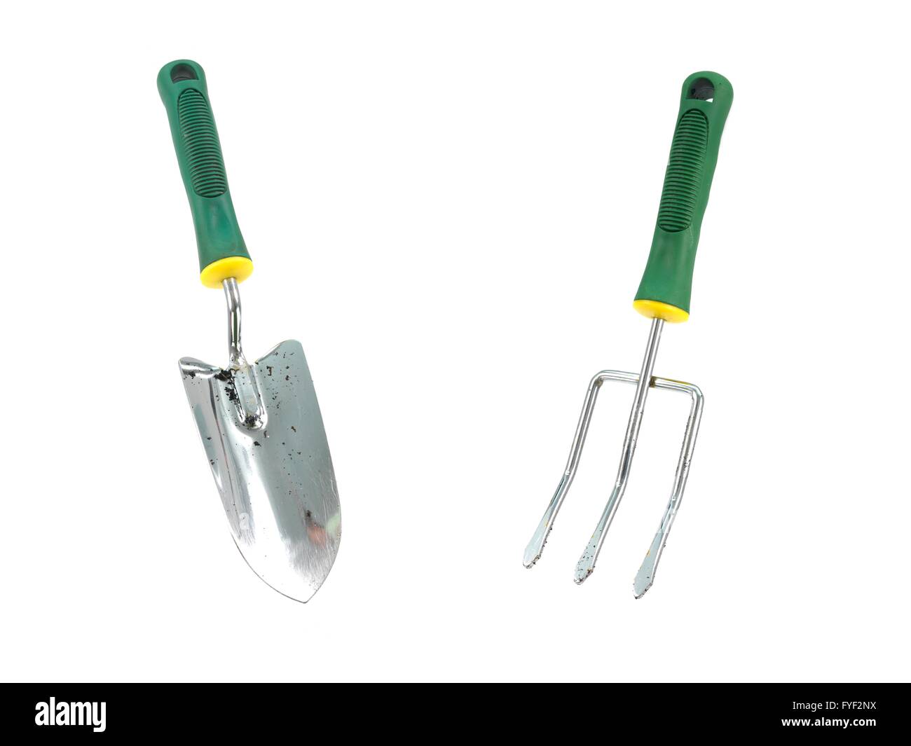 A garden fork and spade isolated against a white background Stock Photo ...