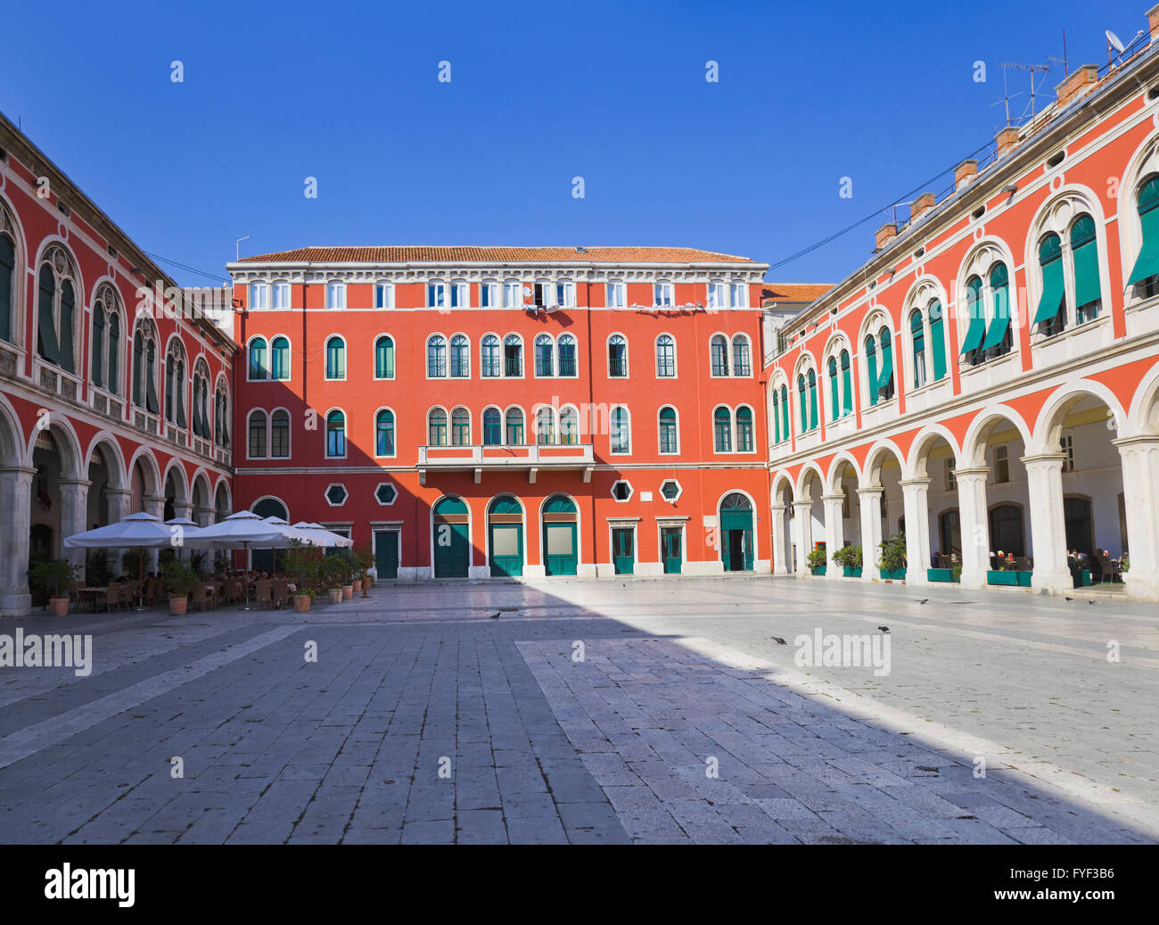 The Mediterranean square and red palace in Split, Croatia Stock Photo ...