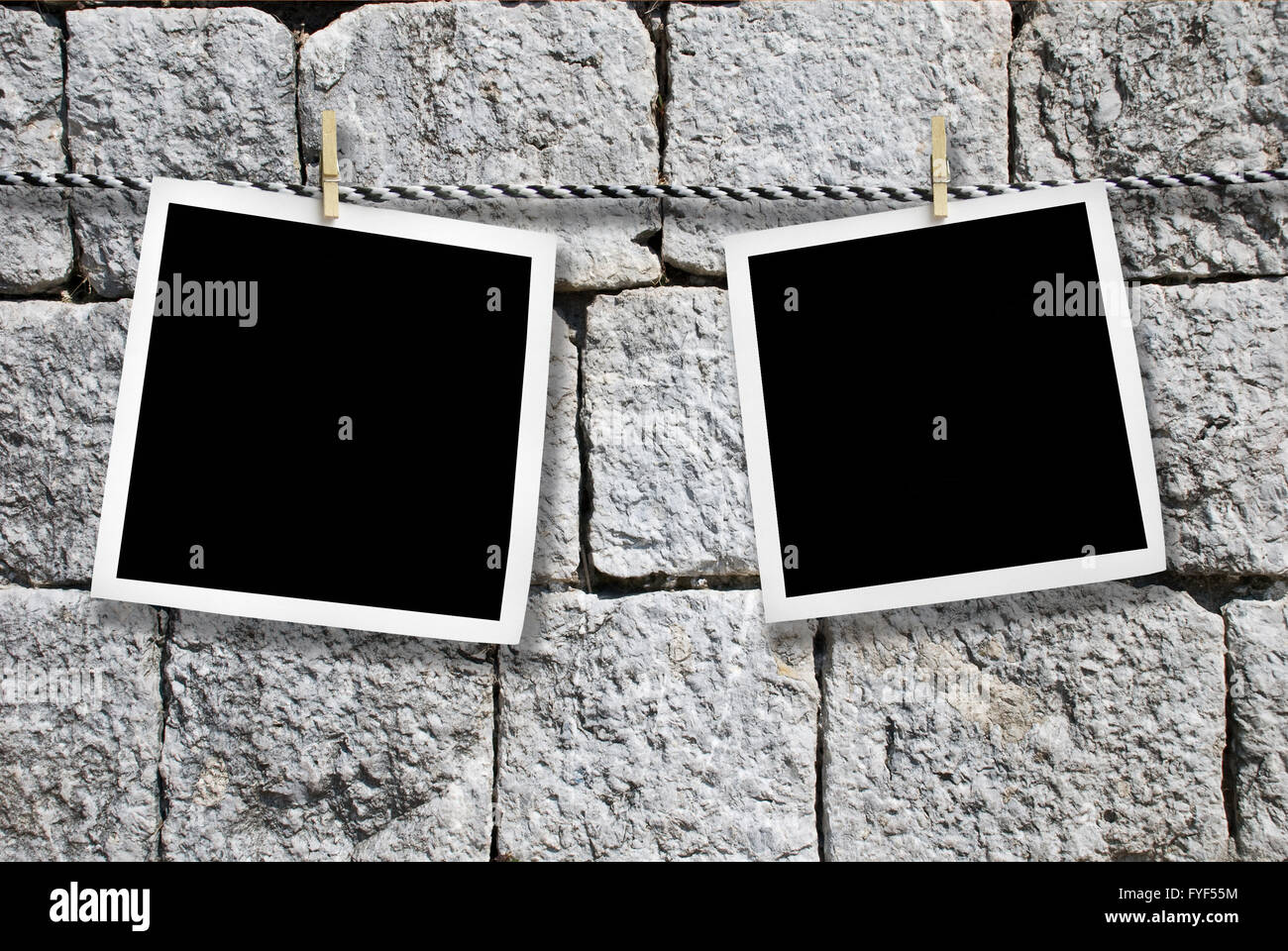 Vintage photos on a rope Stock Photo - Alamy