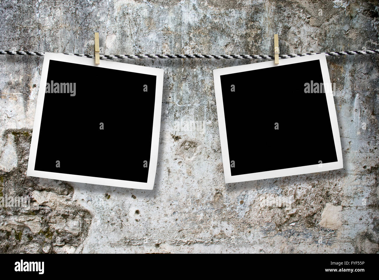 Vintage photos on a rope Stock Photo - Alamy